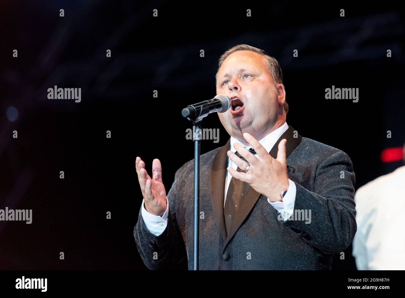 Paul Potts performing on stage in Maldon, Essex, UK. Welsh male ...
