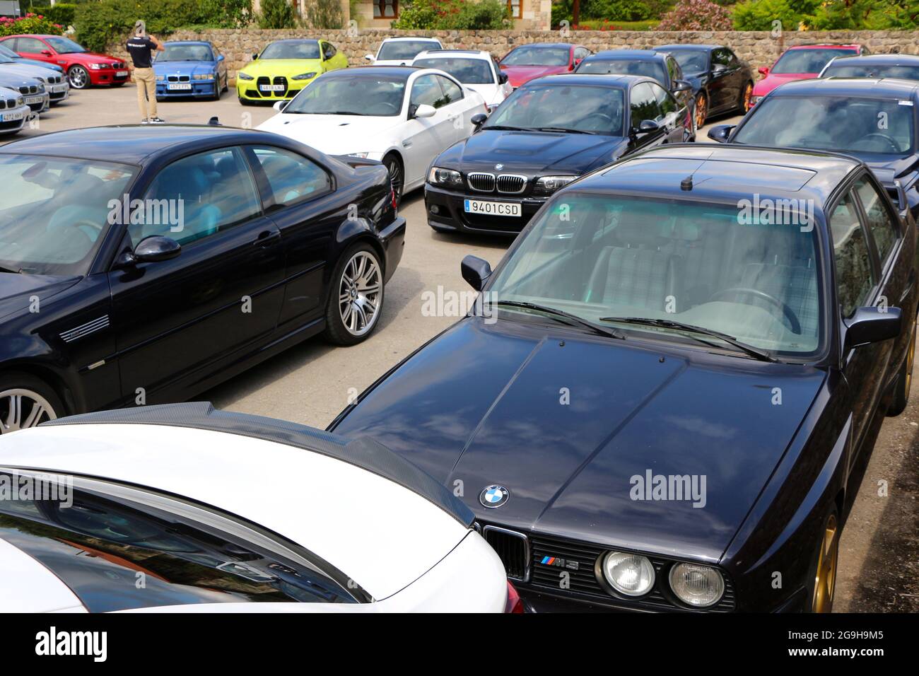 A collection of BMW M performance cars in a car park at an owners club ...