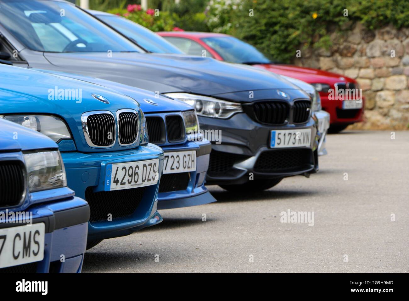 A collection of BMW M performance cars in a car park at an owners club ...