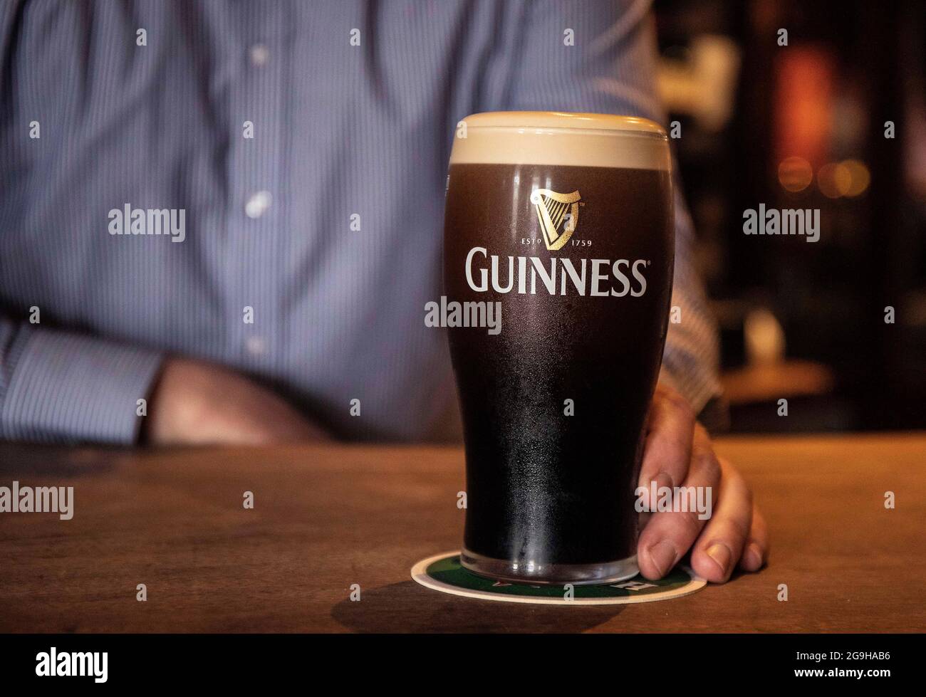 Darren Cusack, barman at Mulligan's in Poolbeg Street, Dublin, pours a ...