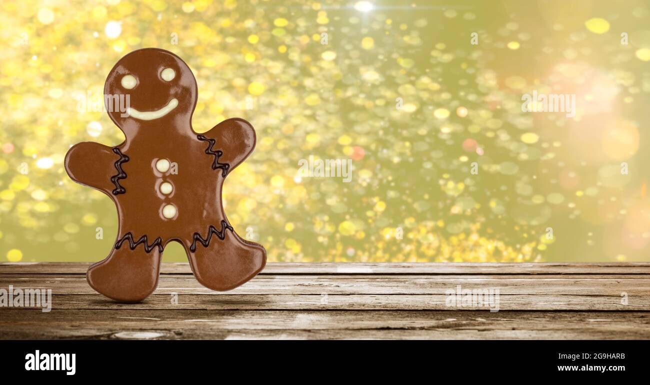 Chocolate gingerbread man on wooden table with shiny background Stock ...