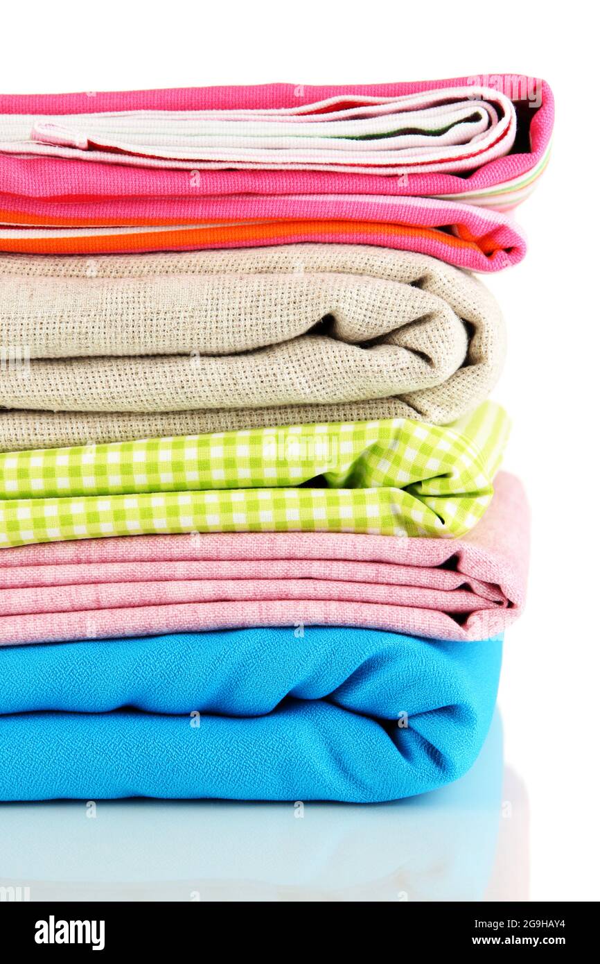 Pile of different fabrics isolated on white Stock Photo - Alamy