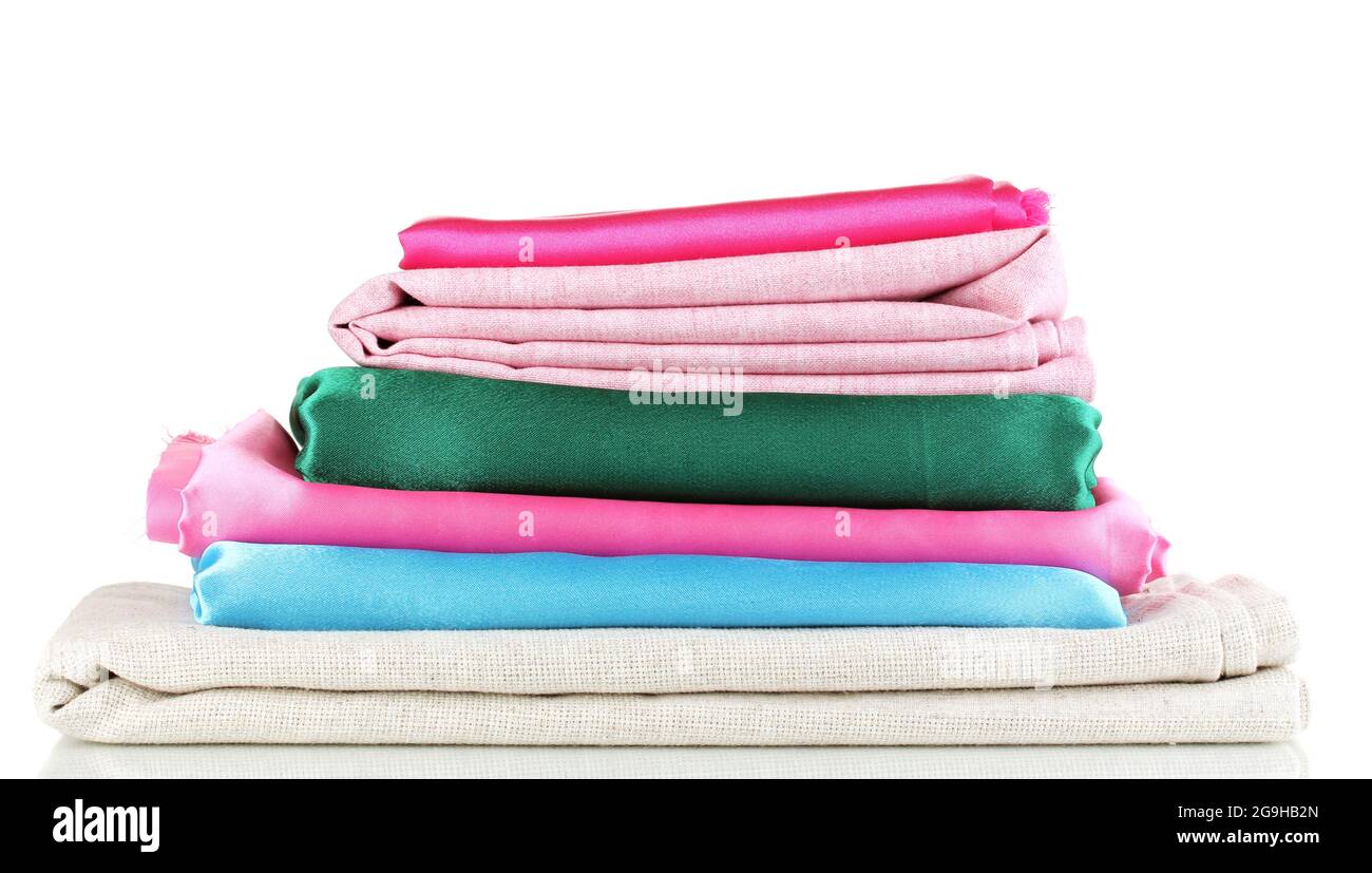 Pile of different fabrics isolated on white Stock Photo - Alamy