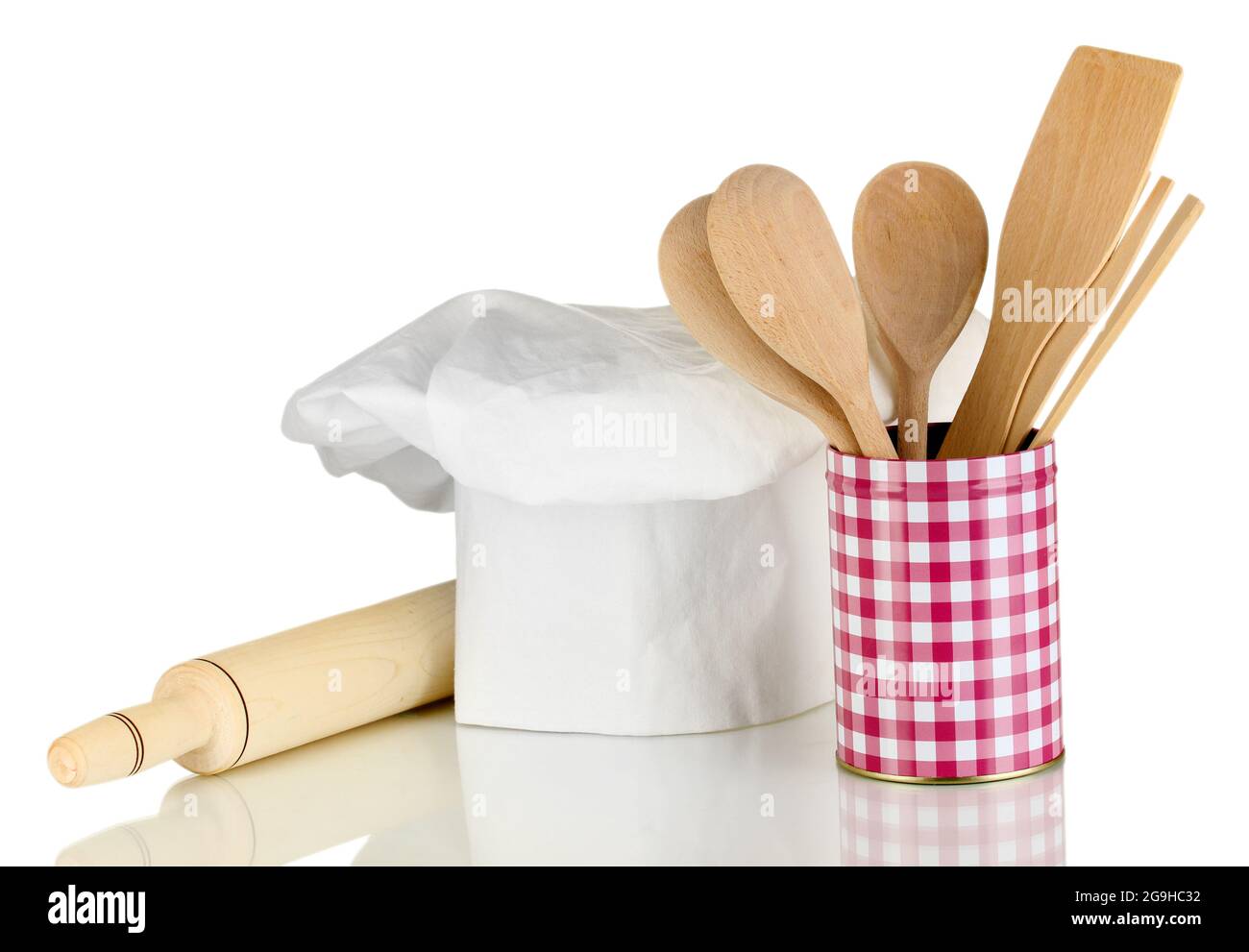 Chef's hat with spoons and battledore isolated on white Stock Photo - Alamy