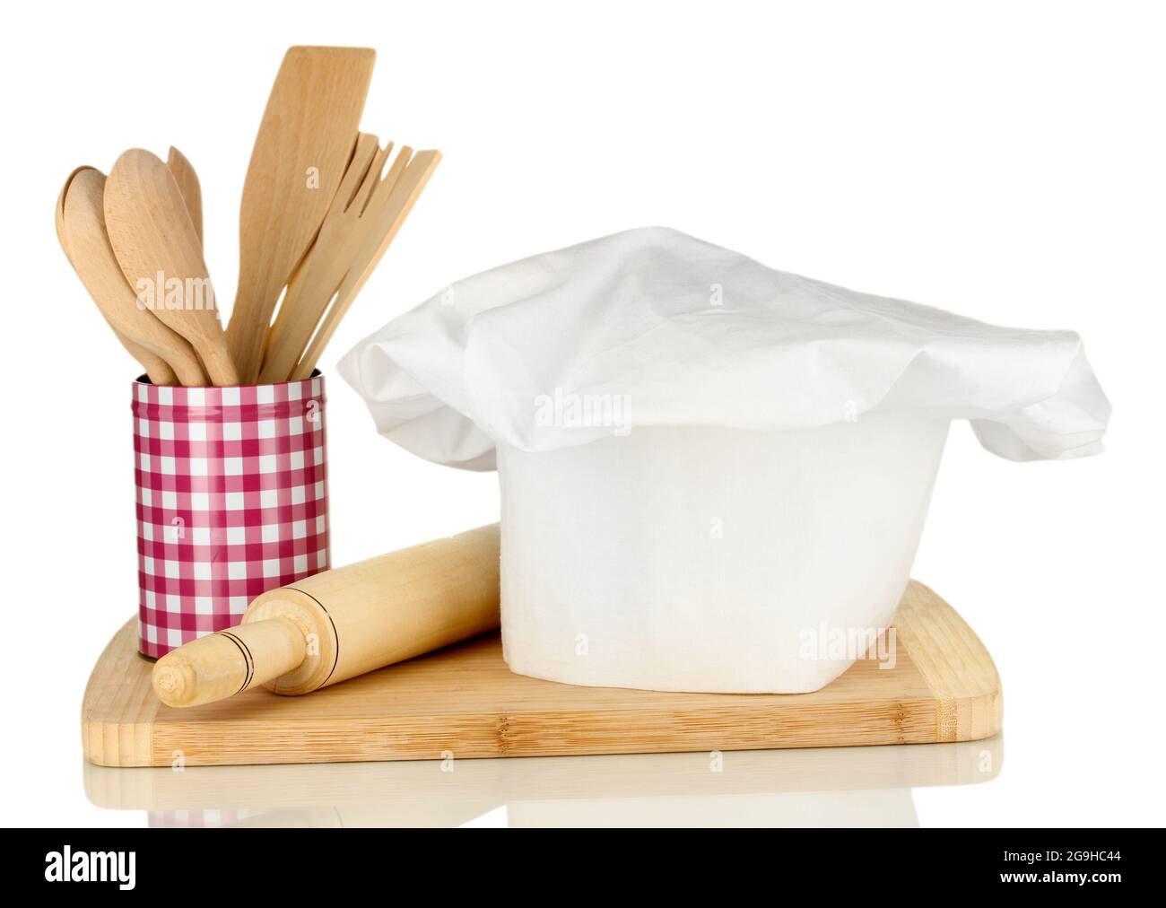 Chef's hat with spoons and battledore isolated on white Stock Photo - Alamy
