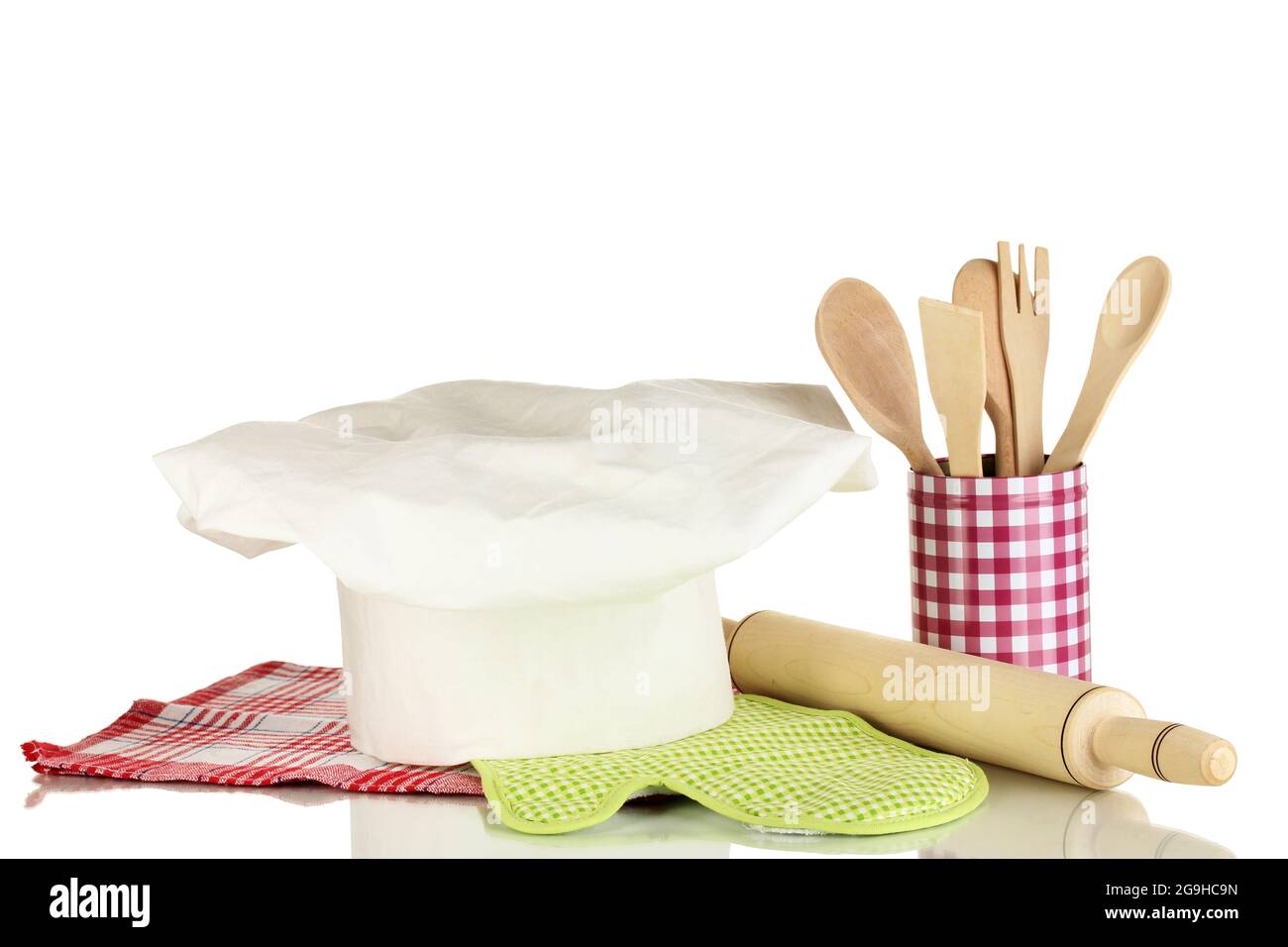 Chef's hat with spoons and battledore isolated on white Stock Photo - Alamy