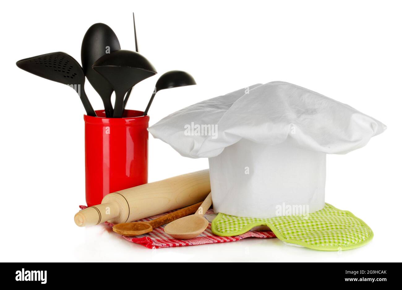 Chef's hat with spoons and battledore isolated on white Stock Photo - Alamy