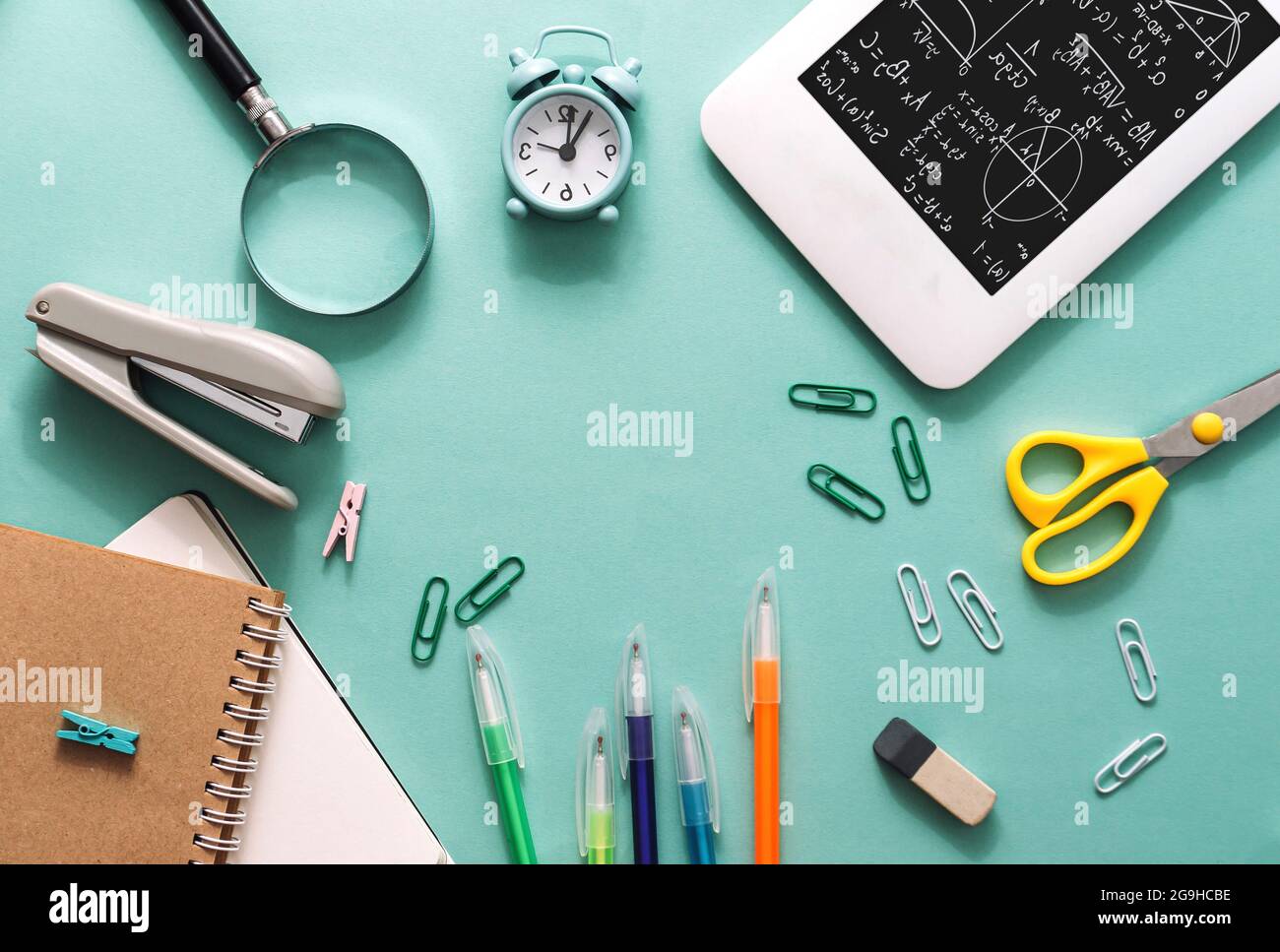 Set of stationery on a blue paper background. Exam readiness concept ...