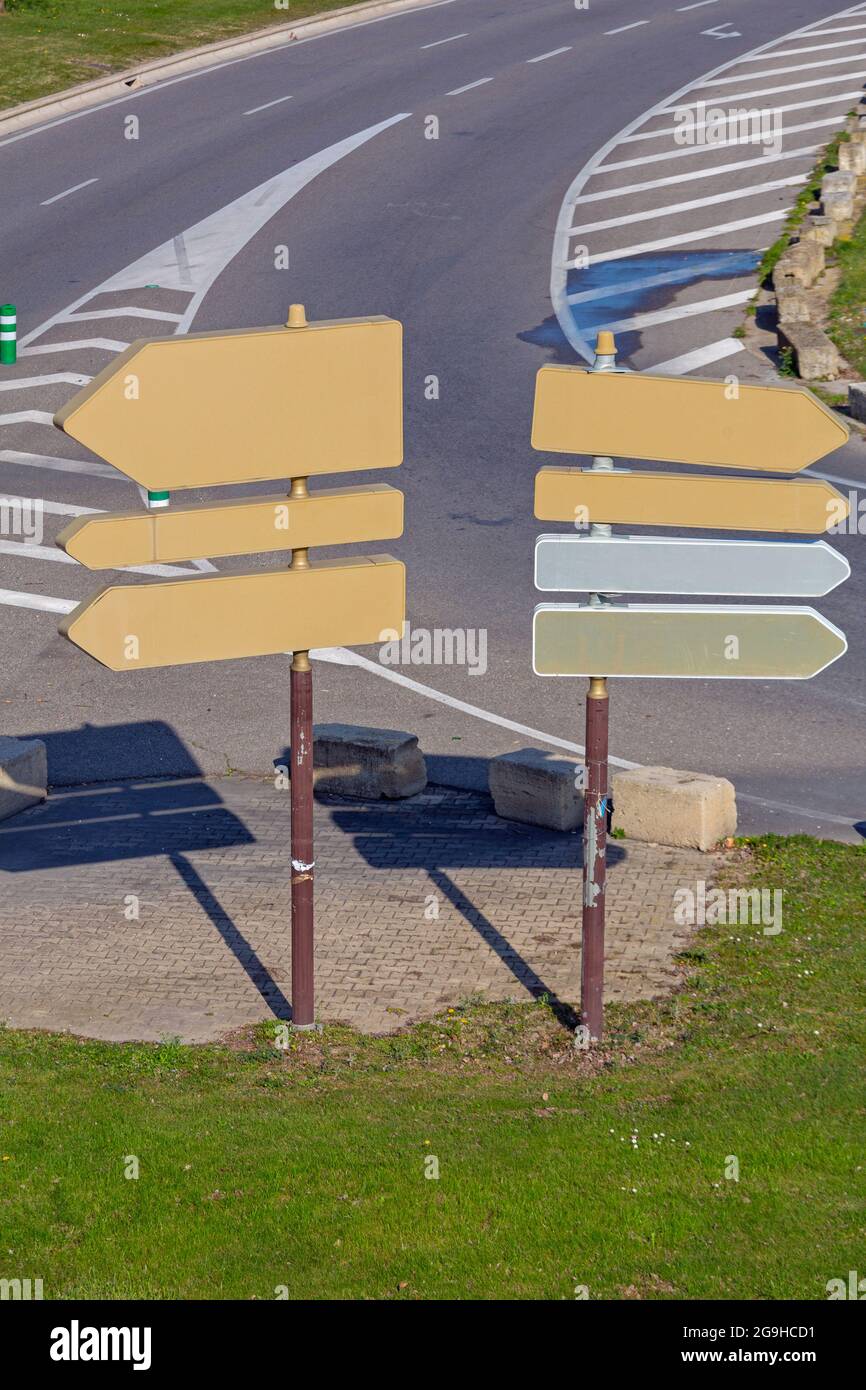 Two Traffic Sign Poles With Directional Arrows in France Stock Photo ...