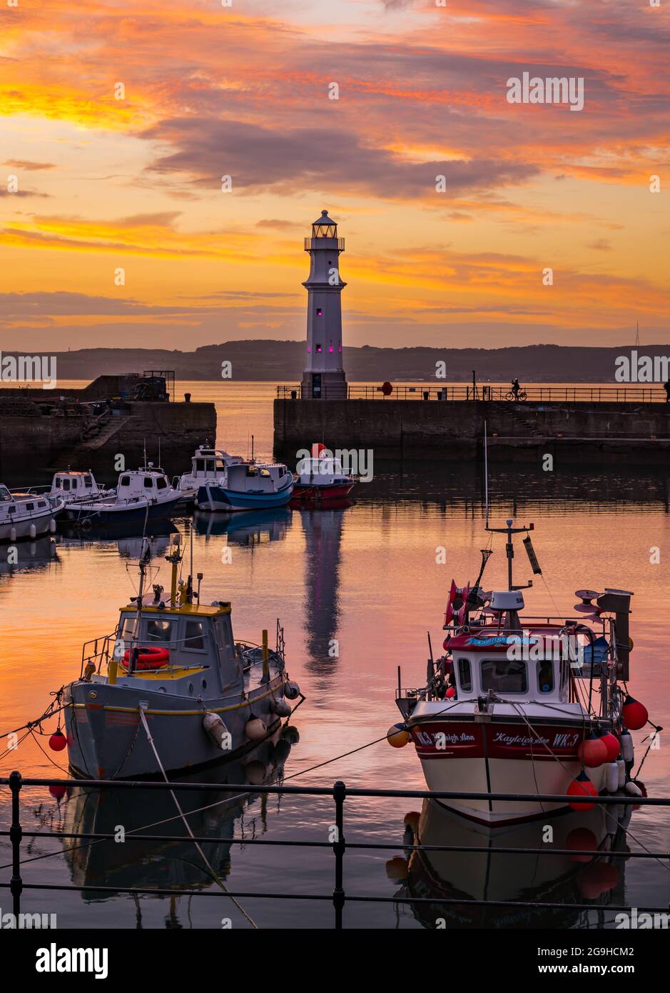 Fishing boats and lighthouse hi-res stock photography and images - Alamy