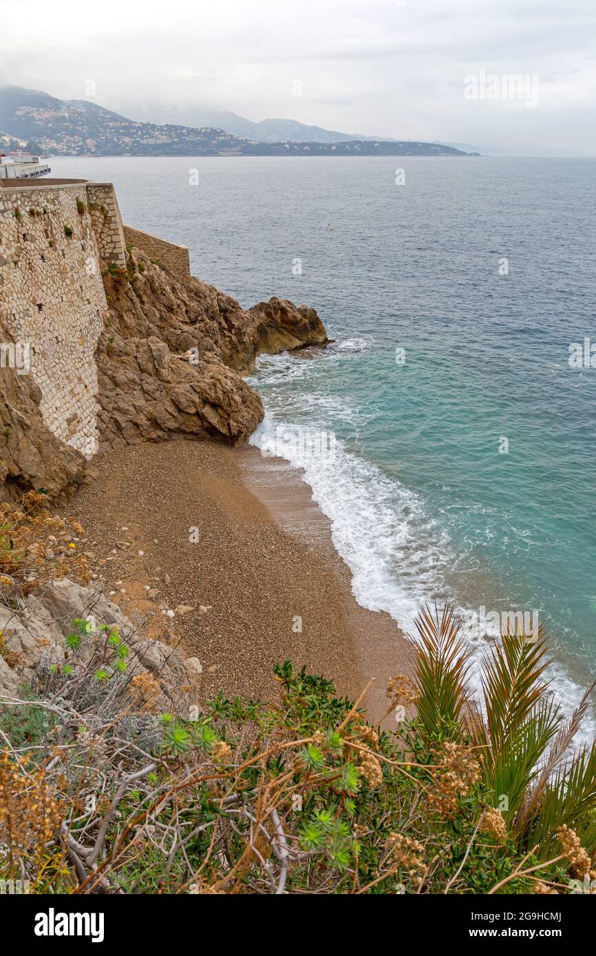 Cliff and Small Beach at Mediterranean Coast in Monaco Stock Photo - Alamy
