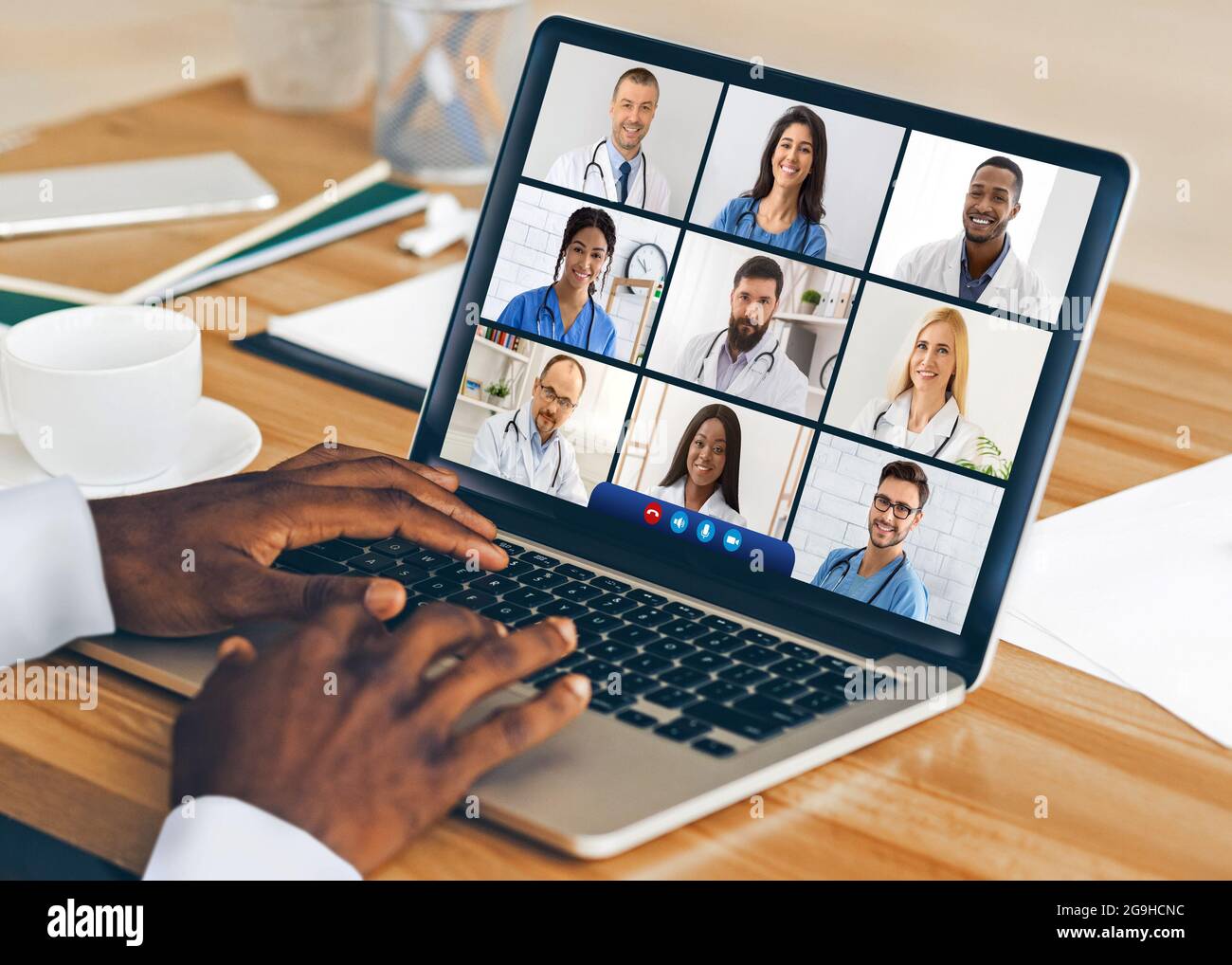 Black Male Doctor At Laptop Having Video Conference Talking With ...