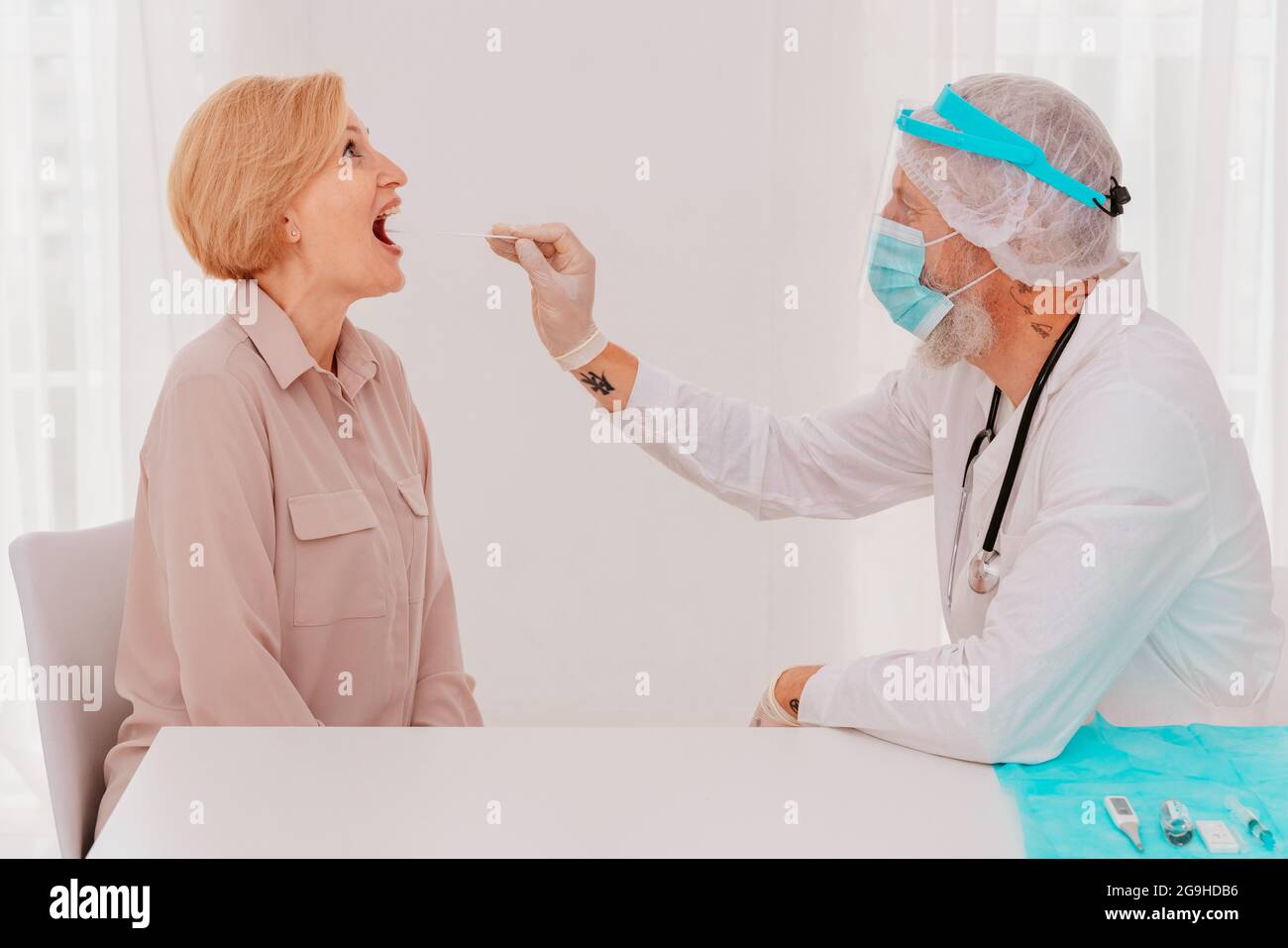 Doctor is checking the covid-19 virus with a tester Stock Photo - Alamy