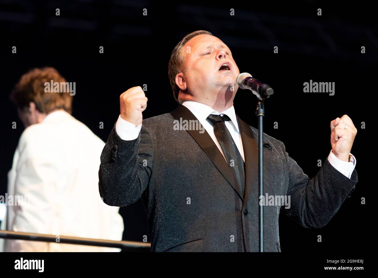 Paul Potts performing on stage in Maldon, Essex, UK. Welsh male ...