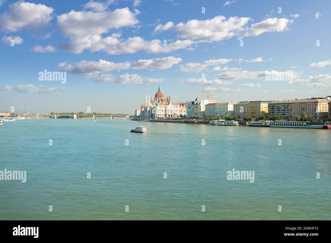 Afternoon on the River Danube with the Danube promenade and the ...