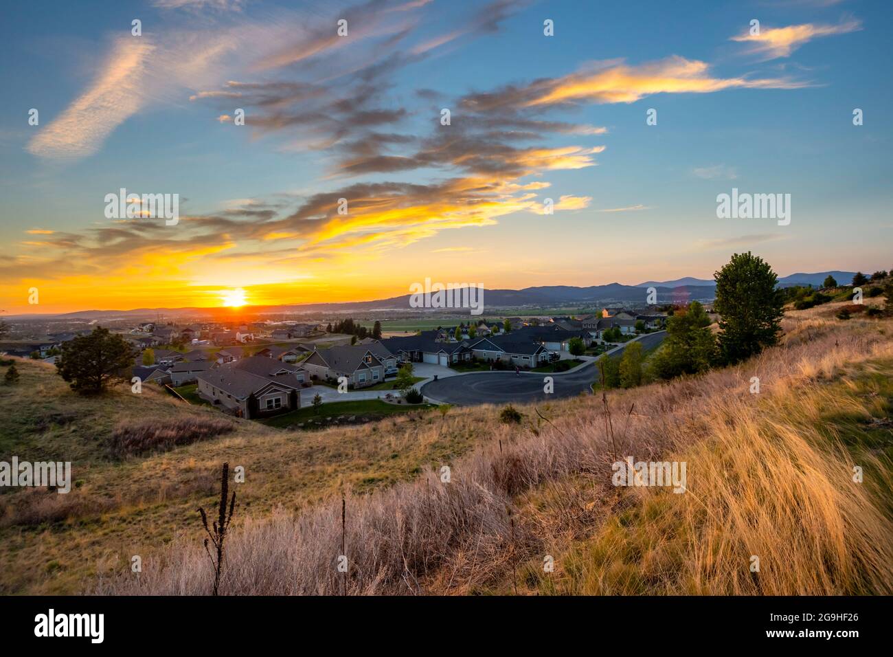 A setting sun during mid summer showing the cities of Spokane, Spokane ...