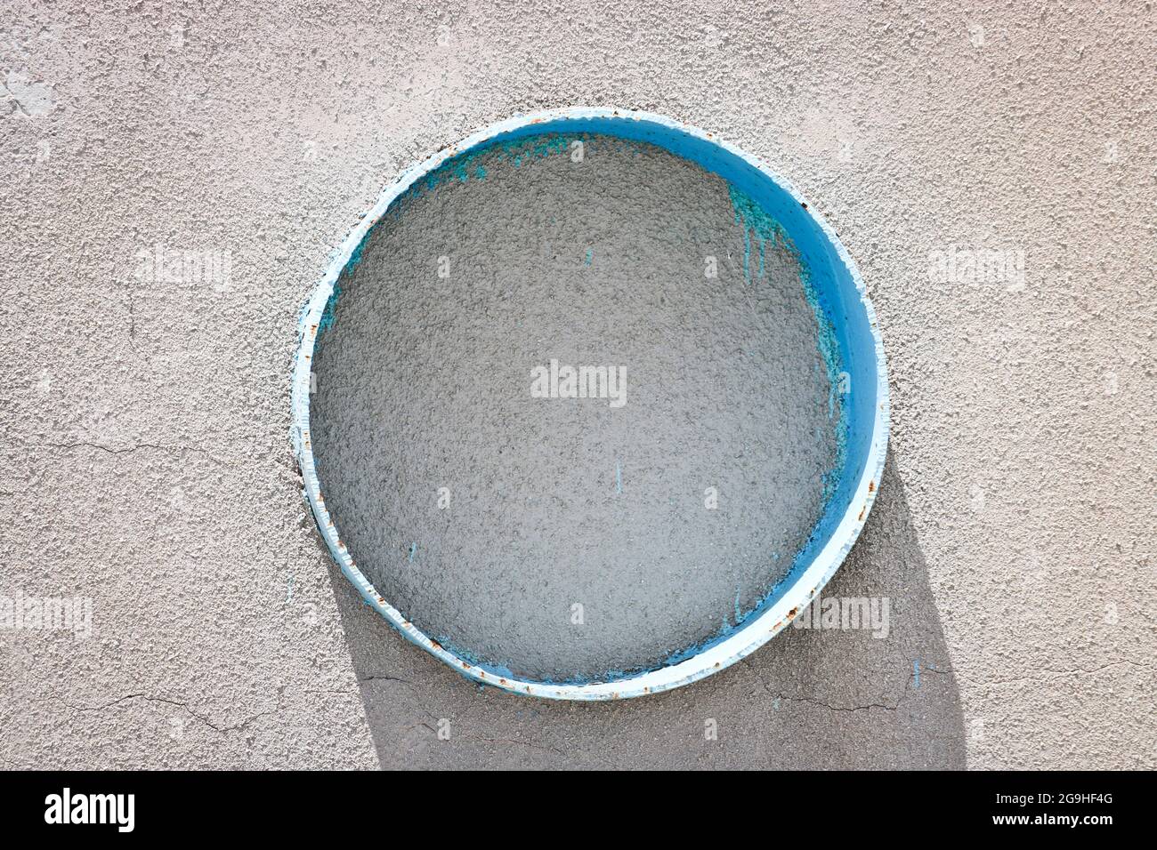 Round structure in a cement wall covered with cracked plaster Stock ...