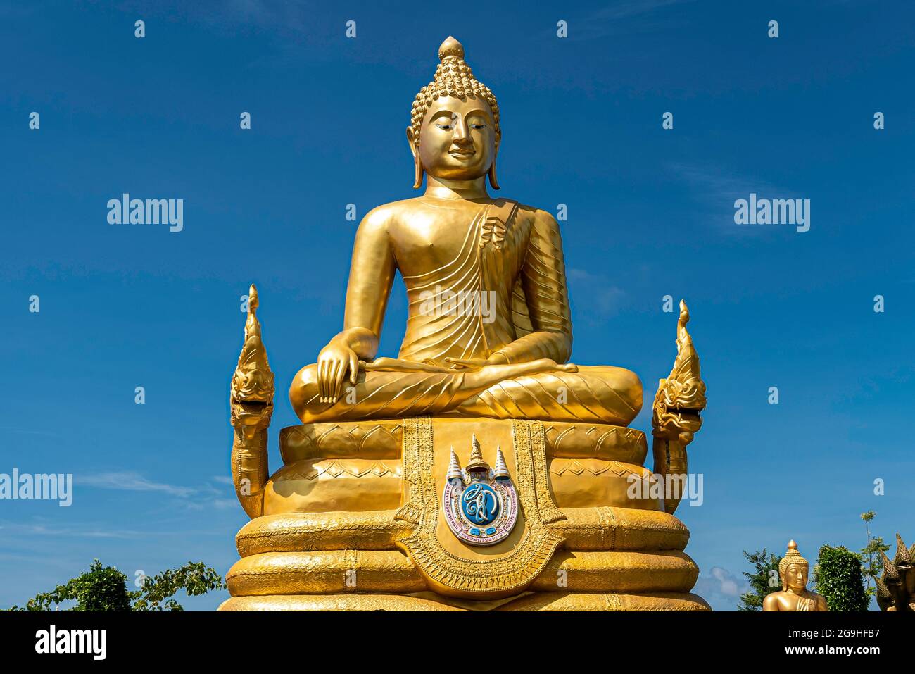 Golden Buddha statue in Phuket Stock Photo - Alamy