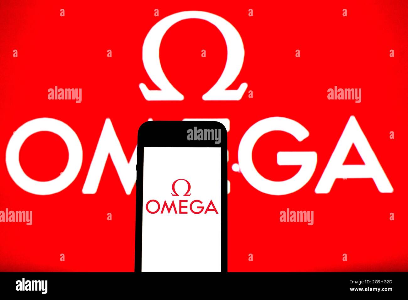 In this photo illustration an Omega SA logo seen displayed on a ...