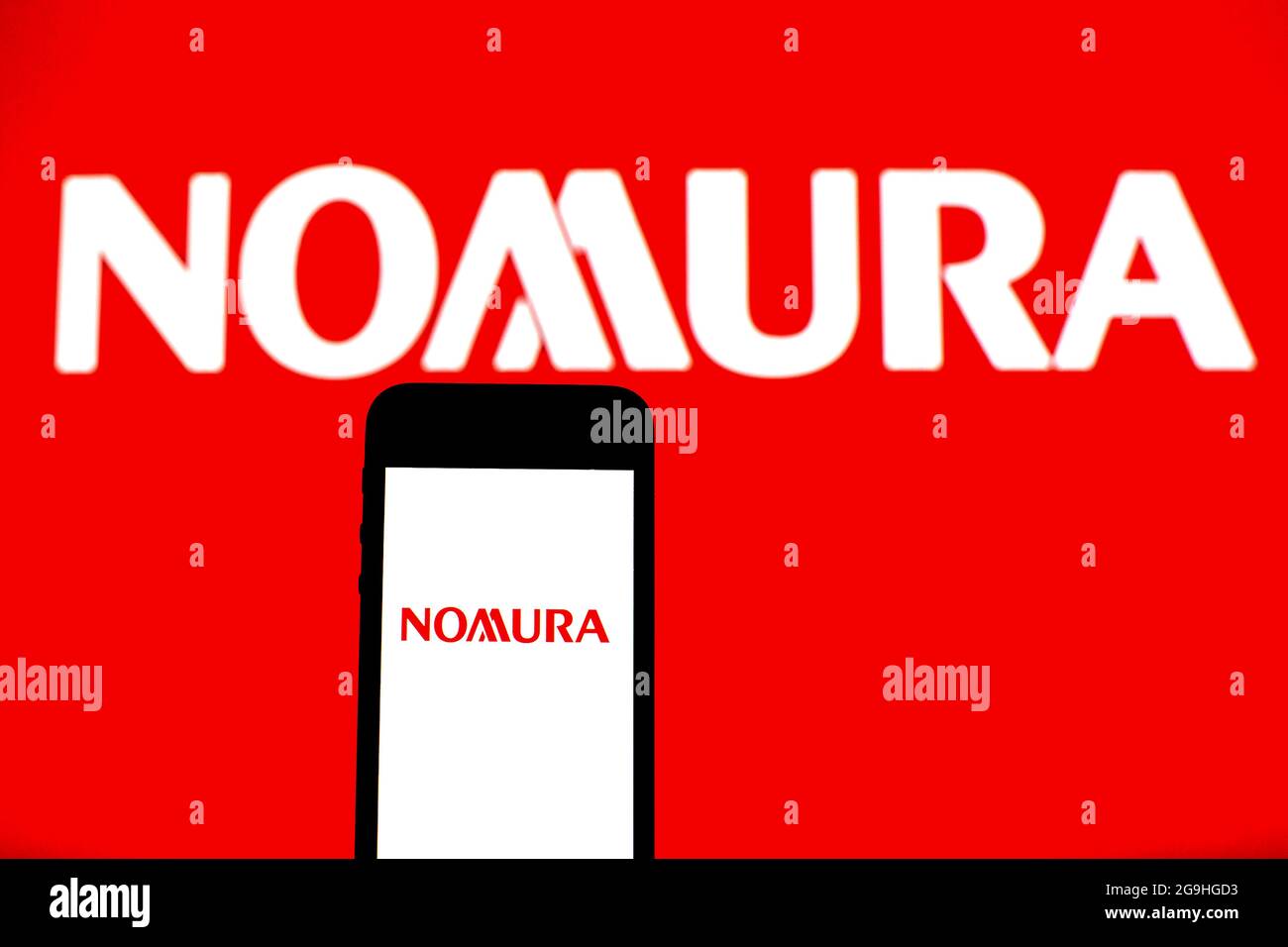 In this photo illustration a Nomura Holdings, Inc logo seen displayed ...