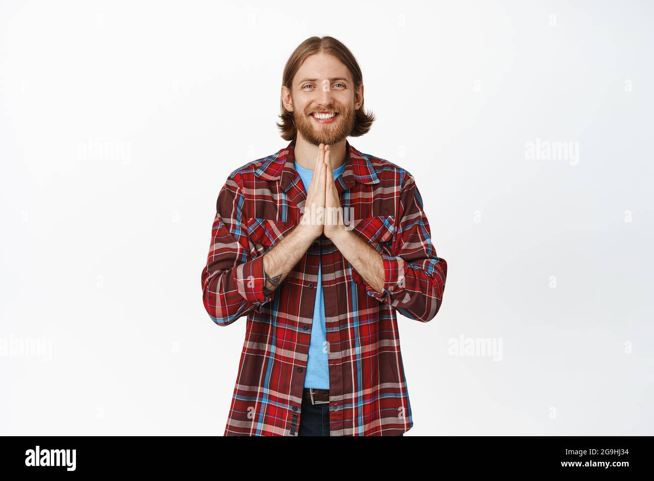 Thank you. Smiling happy blond man, hold hands in namaste pray ...
