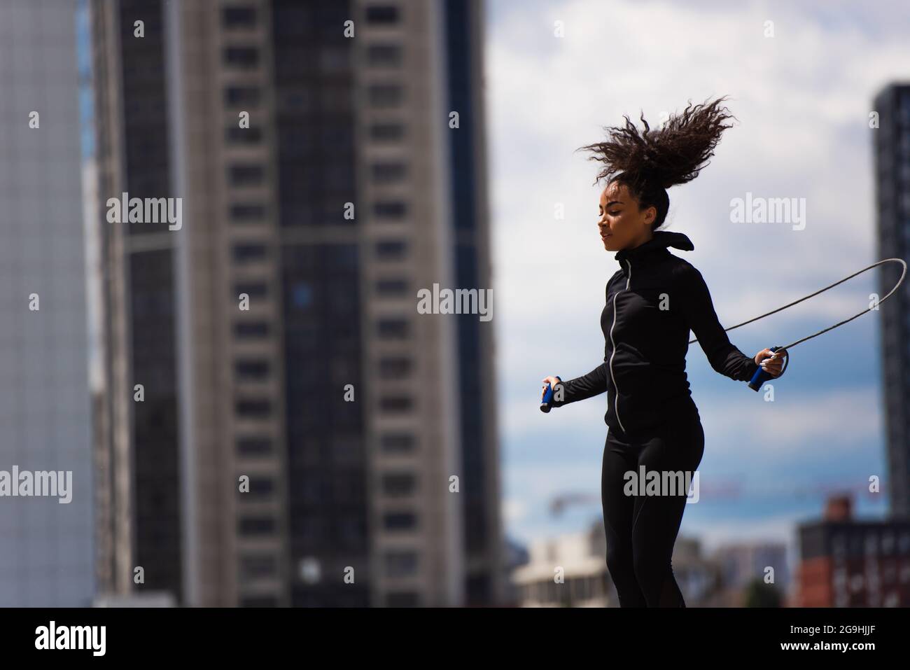 Woman skipping rope outdoors hi-res stock photography and images - Alamy