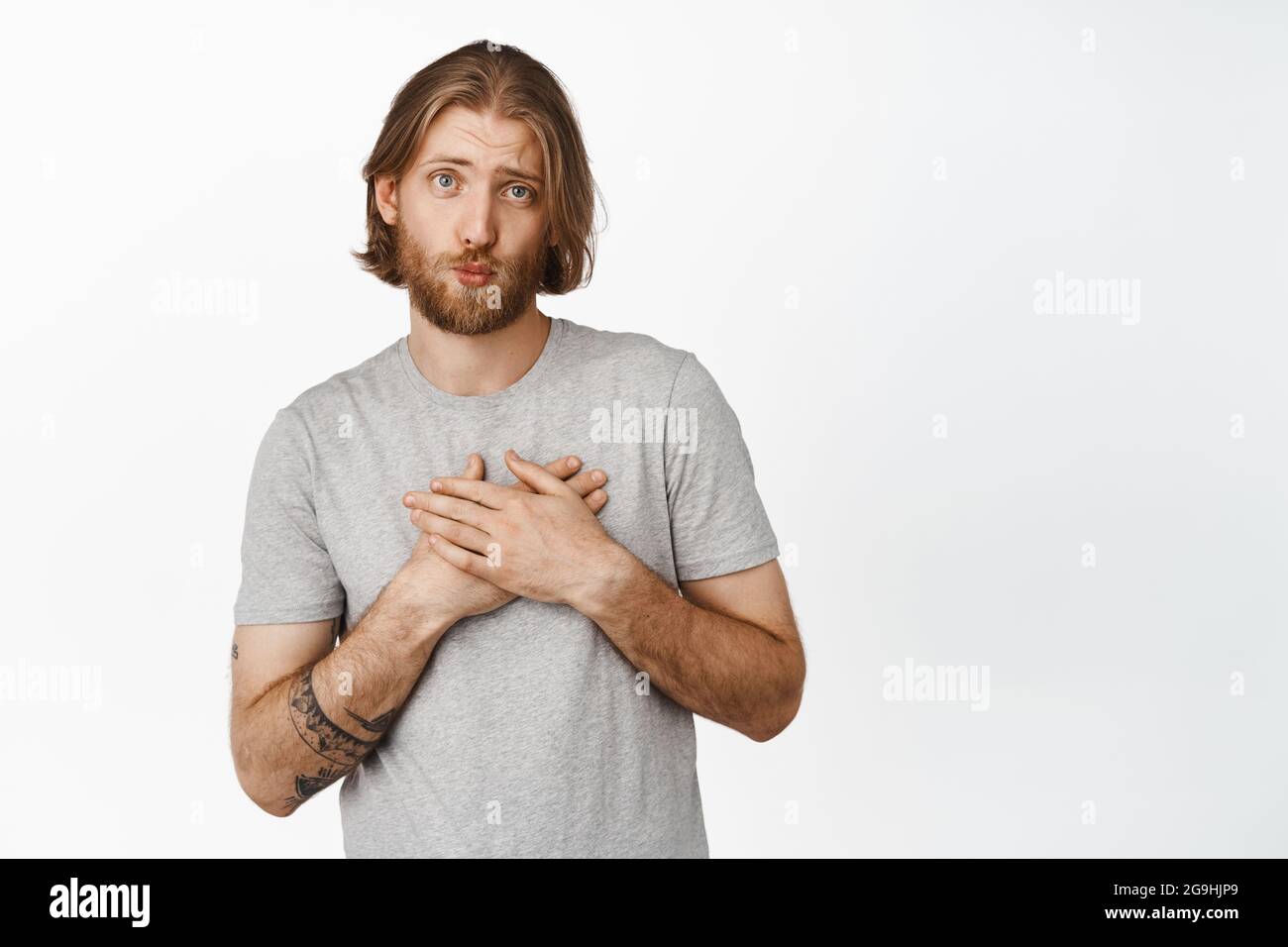 Cute and silly blond bearded guy pucker lips, kissing face, holding ...