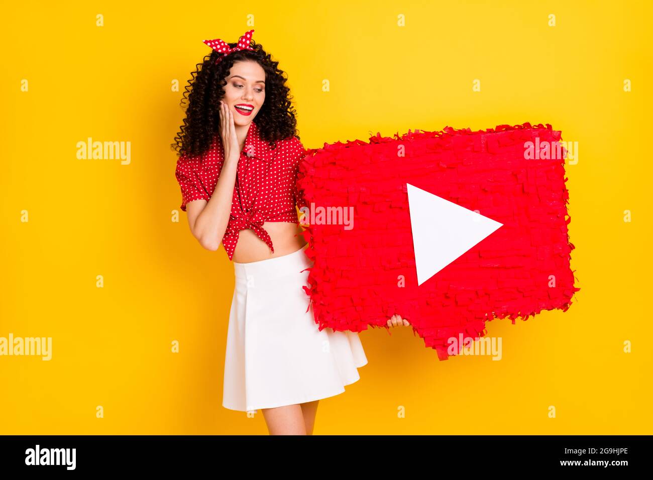 Photo of cute optimistic brunette hair lady hold look pinata hand face ...