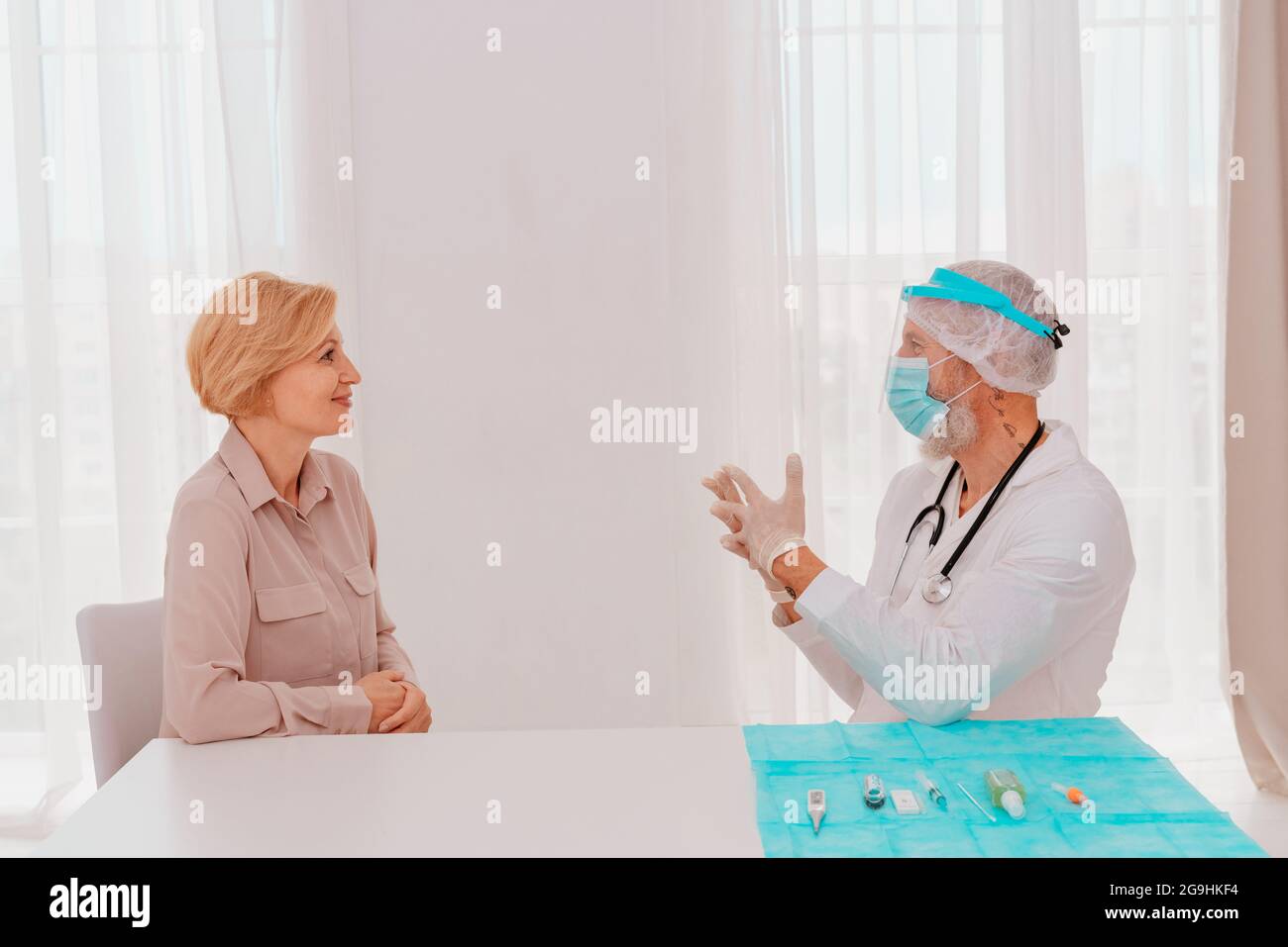 Doctor explain to the patient information about covid-19 virus Stock ...