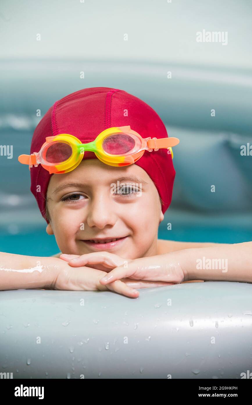 Red swimming cap hi-res stock photography and images - Alamy
