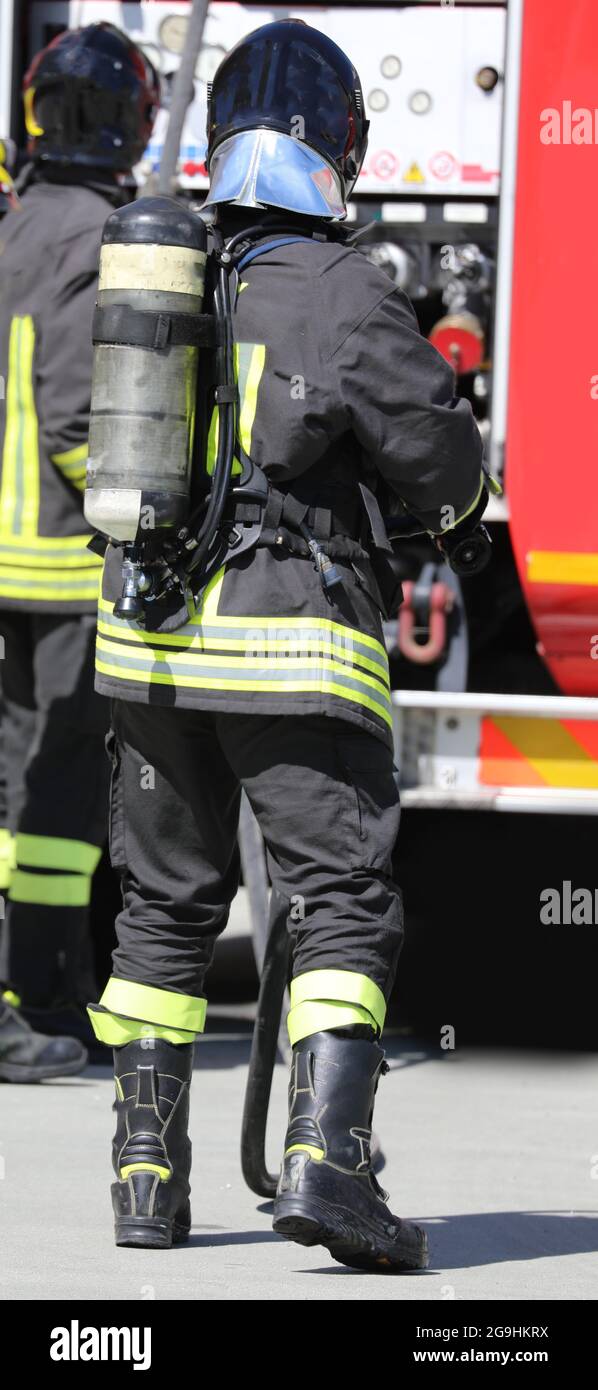 firefighter with oxygen cylinder of self-contained breathing apparatus ...