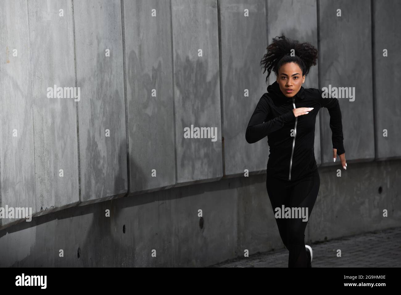 Black woman running outdoors hi-res stock photography and images - Alamy