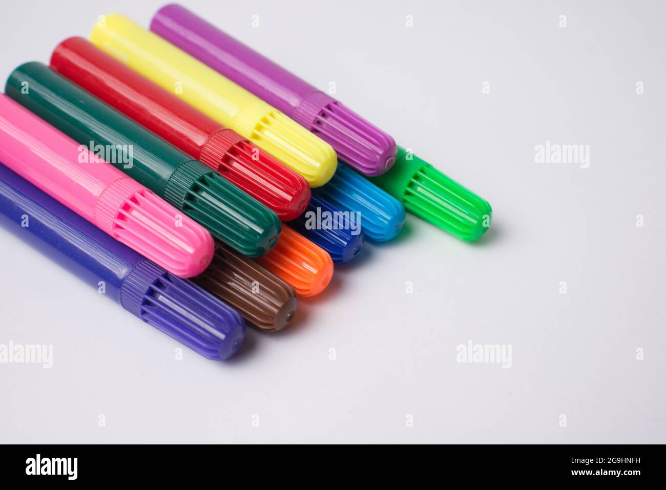 Pile of colorful markers on a white background. Copy space Stock Photo ...