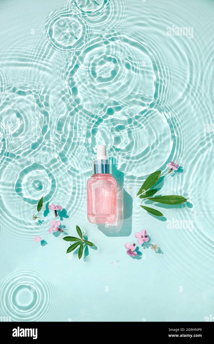Set moisturizing cosmetic products on water texture, aqua surface with ...