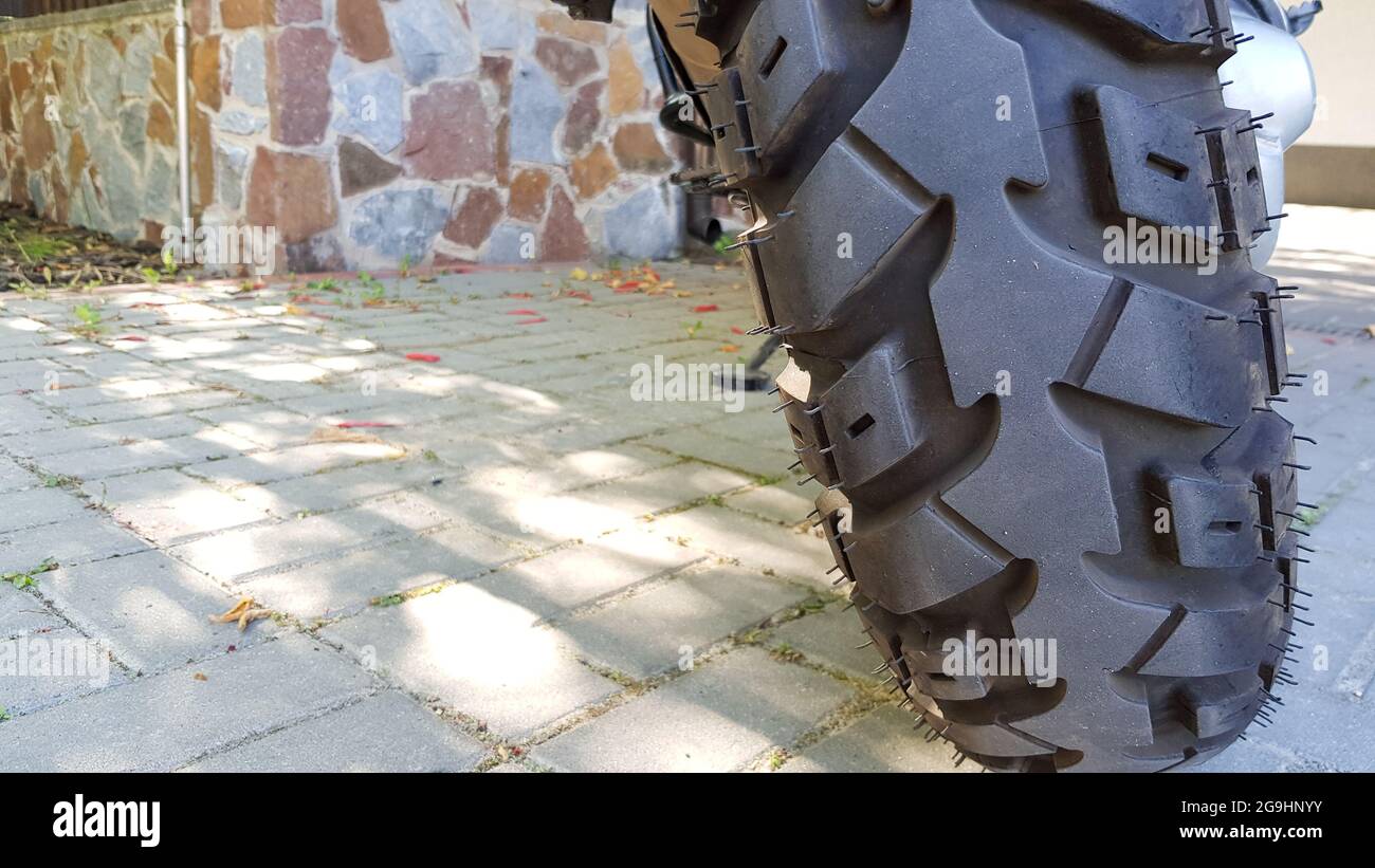 large tread wheel motocross motorcycle close-up for travel Stock Photo ...