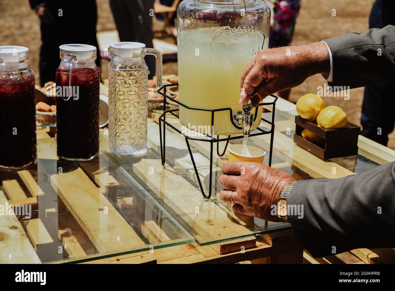 Man pouring fresh lemonade hi-res stock photography and images - Alamy