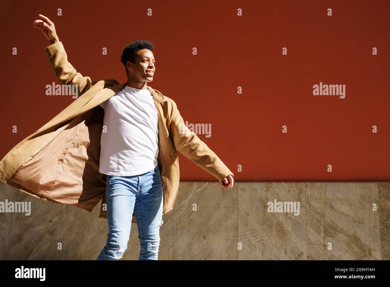 Young black african guy red hi-res stock photography and images - Alamy