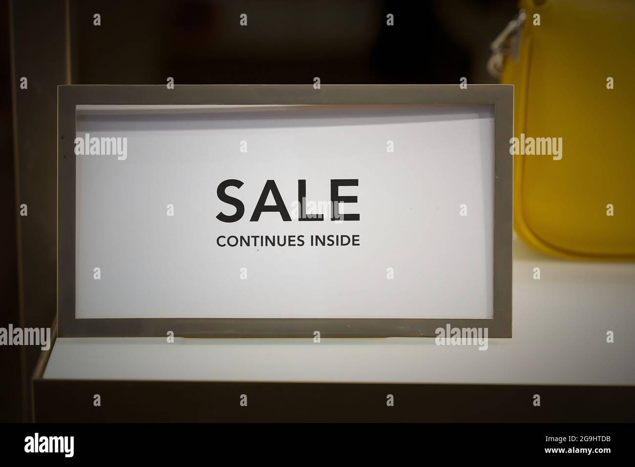 Sign in a shop window in Berlin with the words Sale continues inside ...