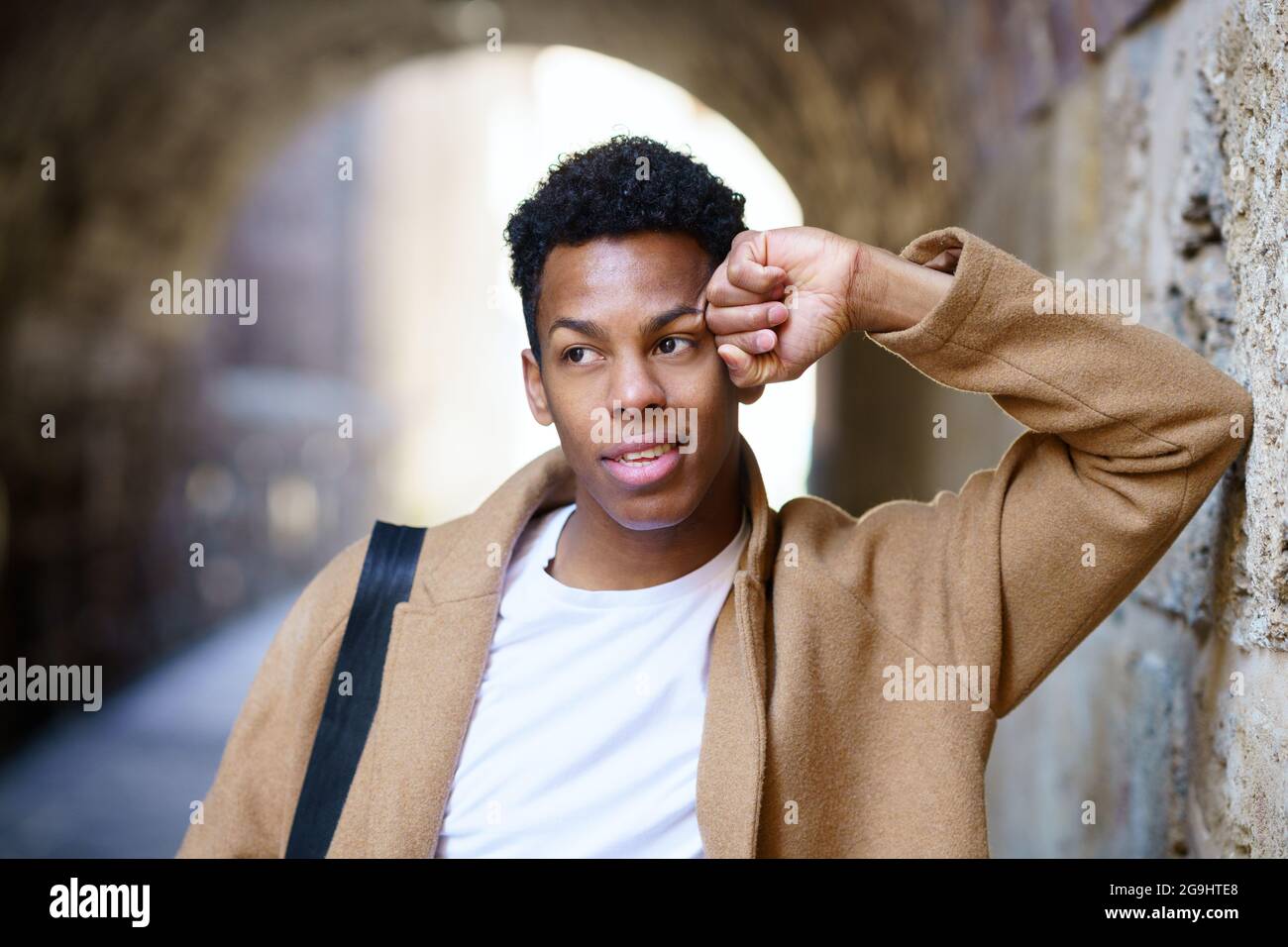 Young Cuban man standing in the street Stock Photo - Alamy