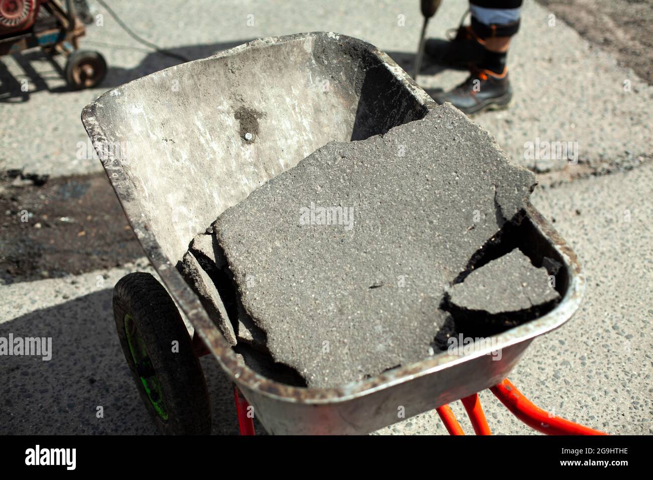 Trolley with asphalt. Road repair. Construction waste trolley. Repair ...