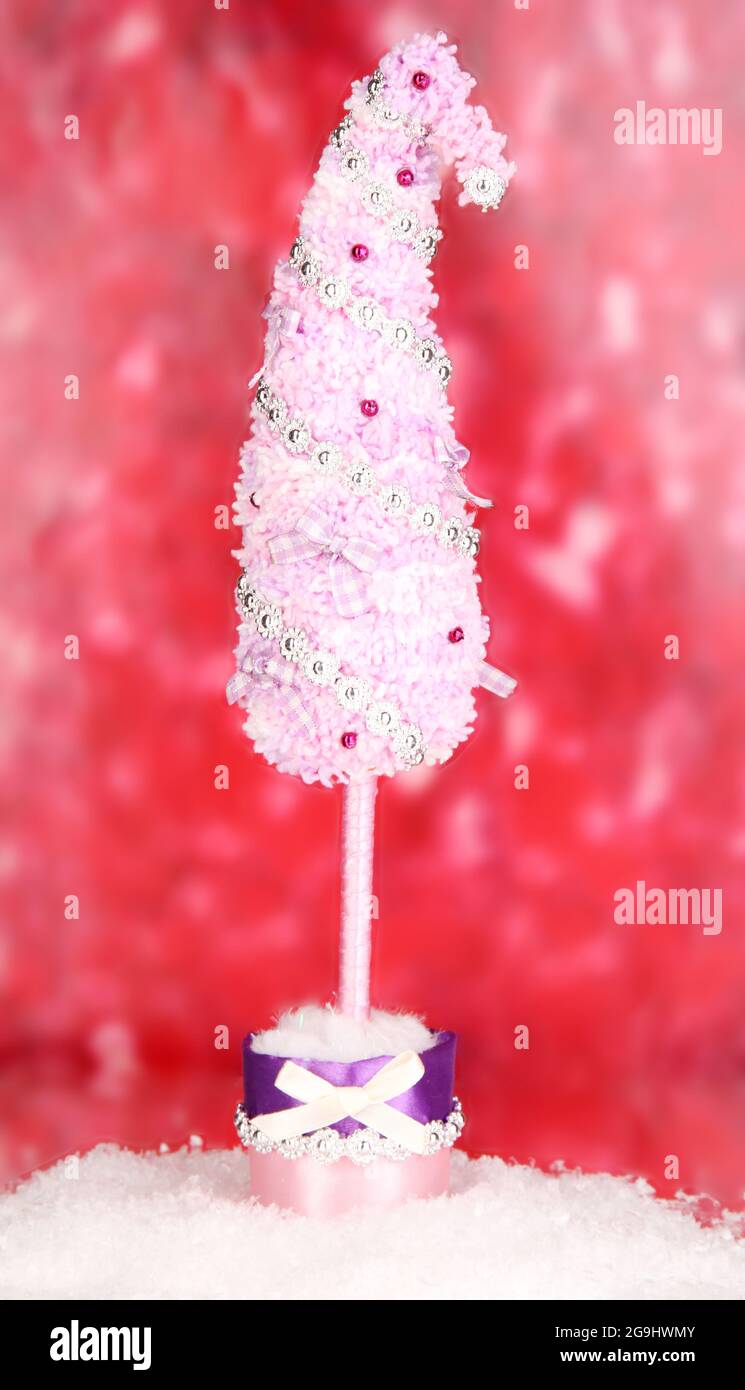 Christmas tree with curved tip on bright background Stock Photo - Alamy