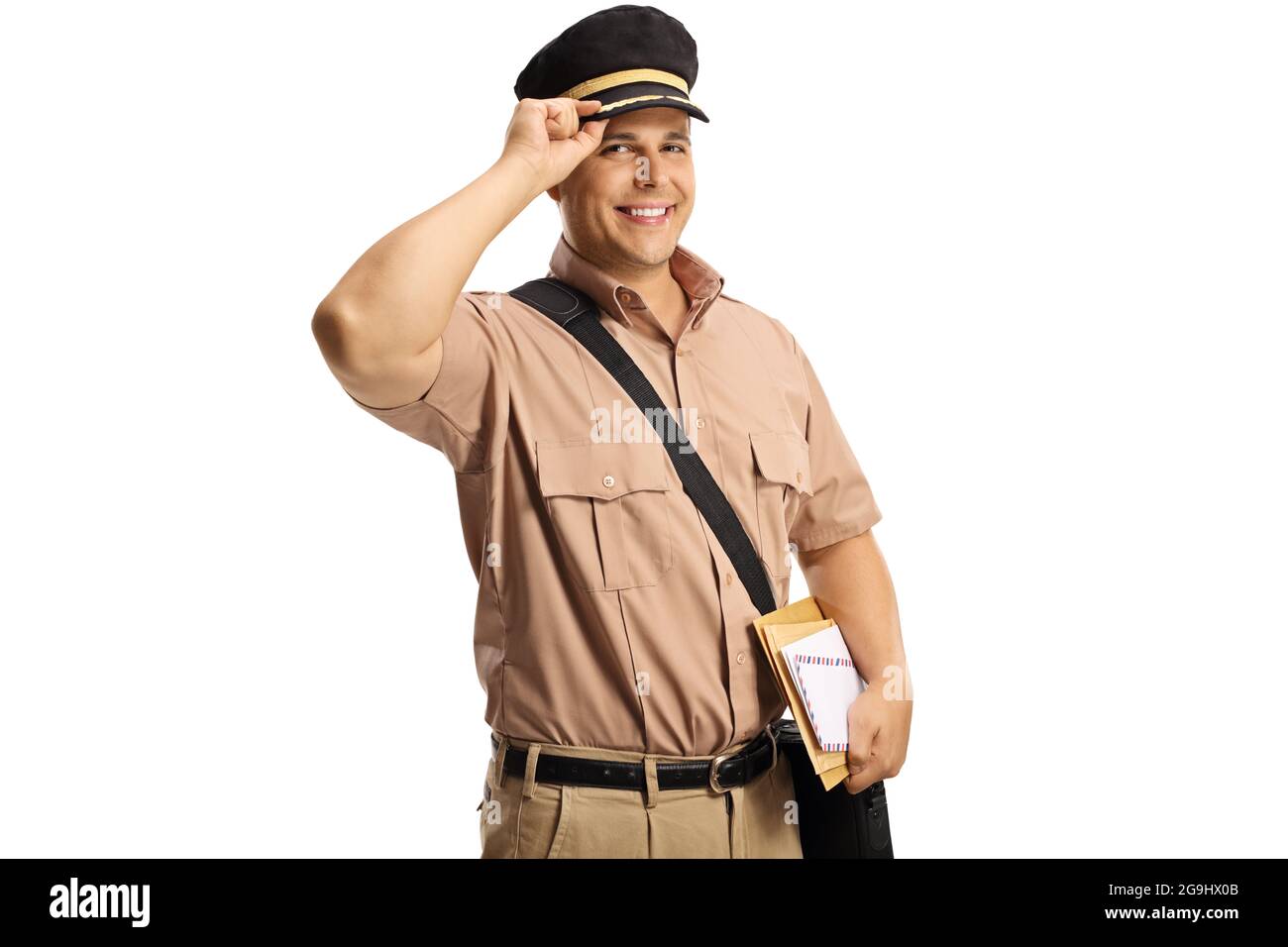 Young mailman in a uniform greeting with his hat isolated on white ...