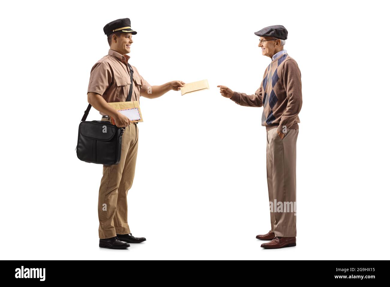 Young smiling mailman in a uniform delivering a letter to an elderly ...