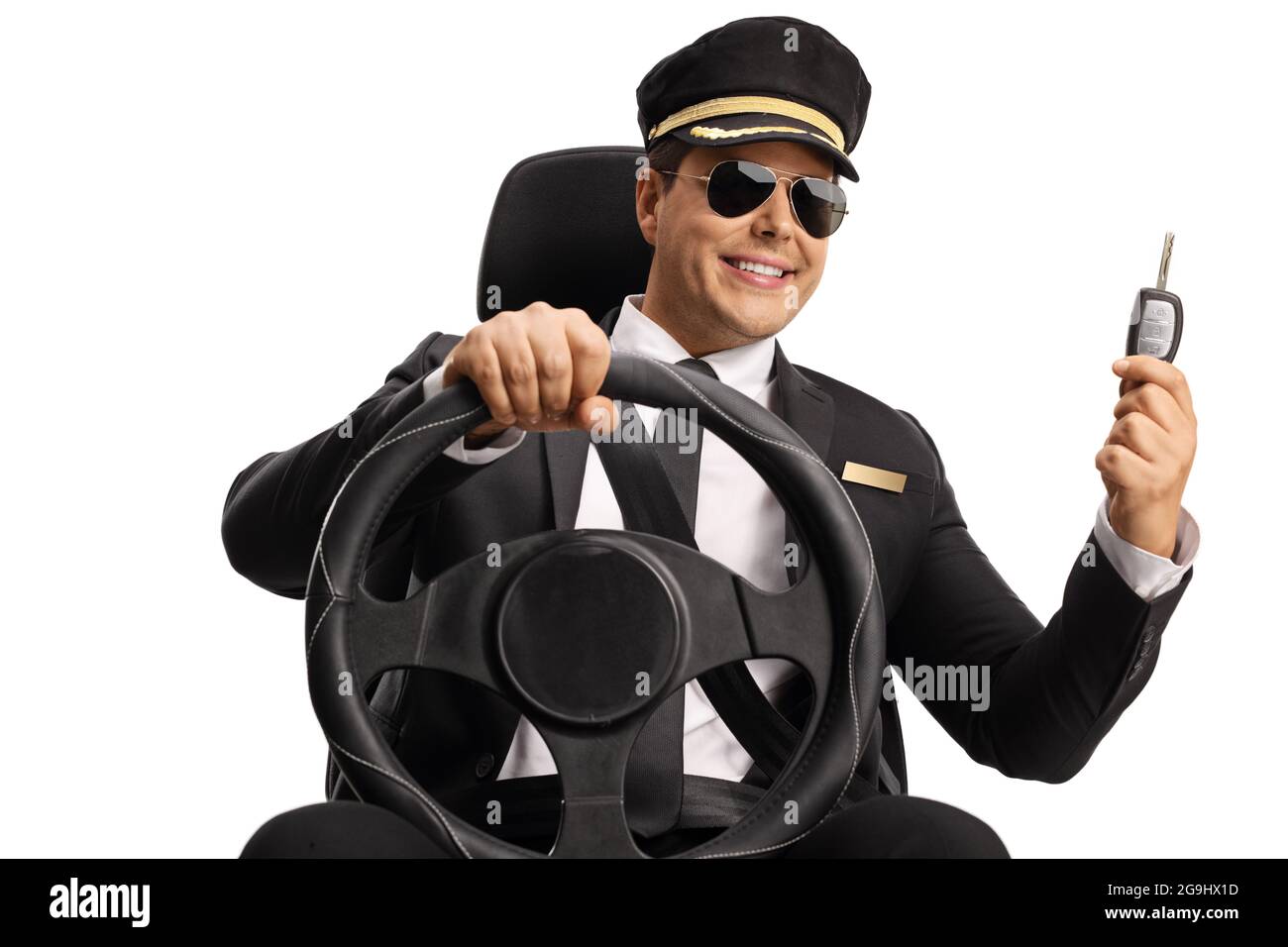 Chauffeur driving a car and showing a key isolated on white backaground ...
