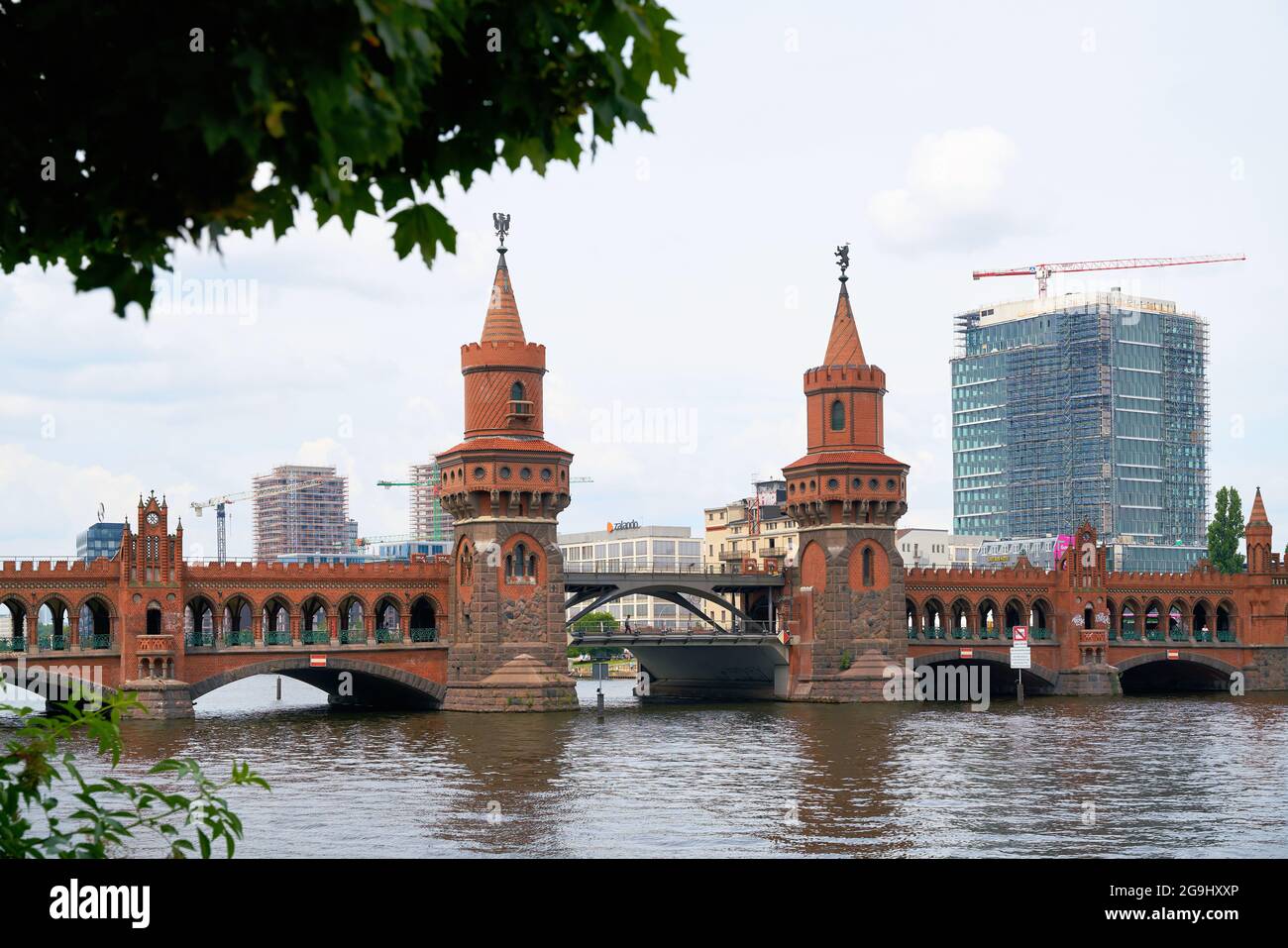 The Oberbaum Bridge over the river Spree in Berlin connects the ...