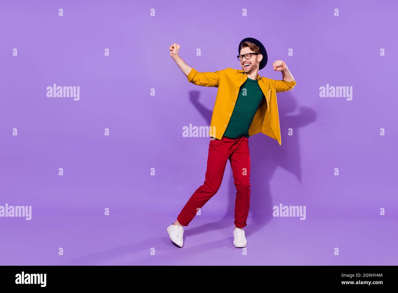 Full body photo of young guy happy positive smile enjoy music dance ...