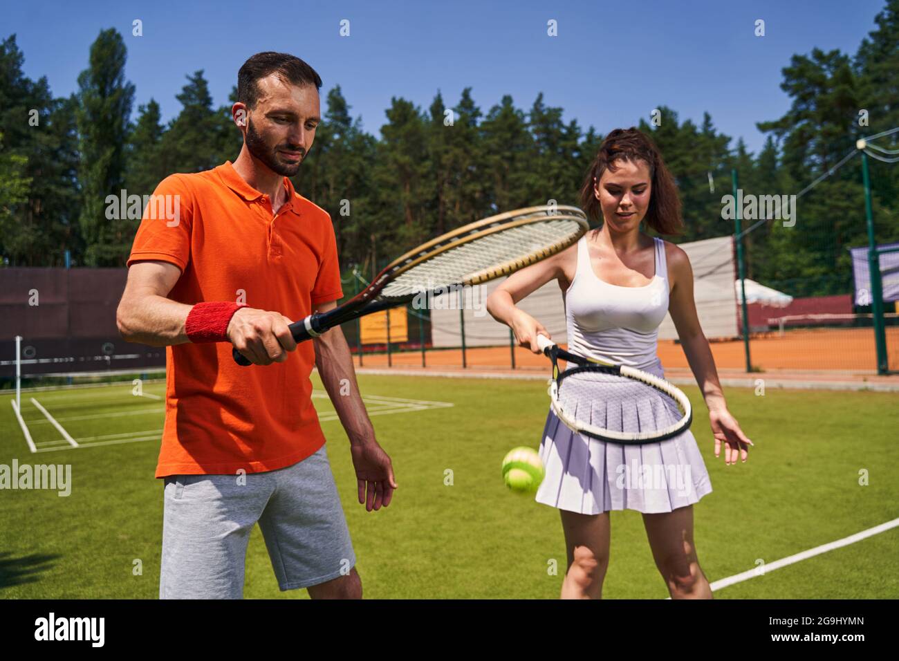 Two attractive tennis players focused on their training session Stock ...