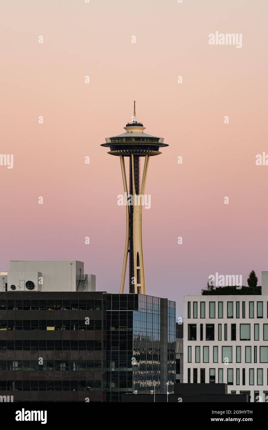 Seattle - July 25, 2021; Seattle Space Needle rising above buildings and against a clear sky at ...