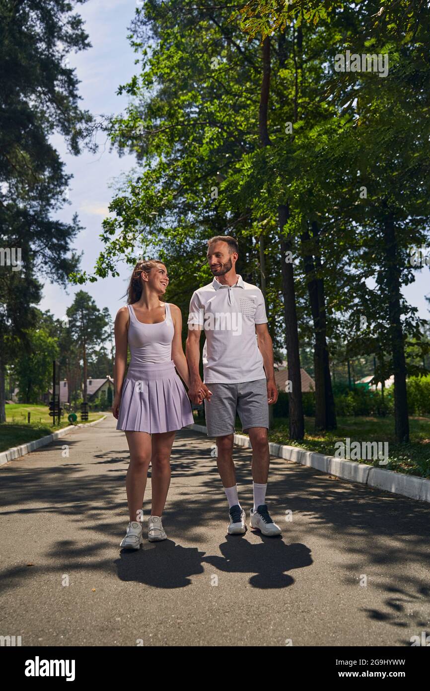 Romantic young couple standing on the road in the countryside Stock ...