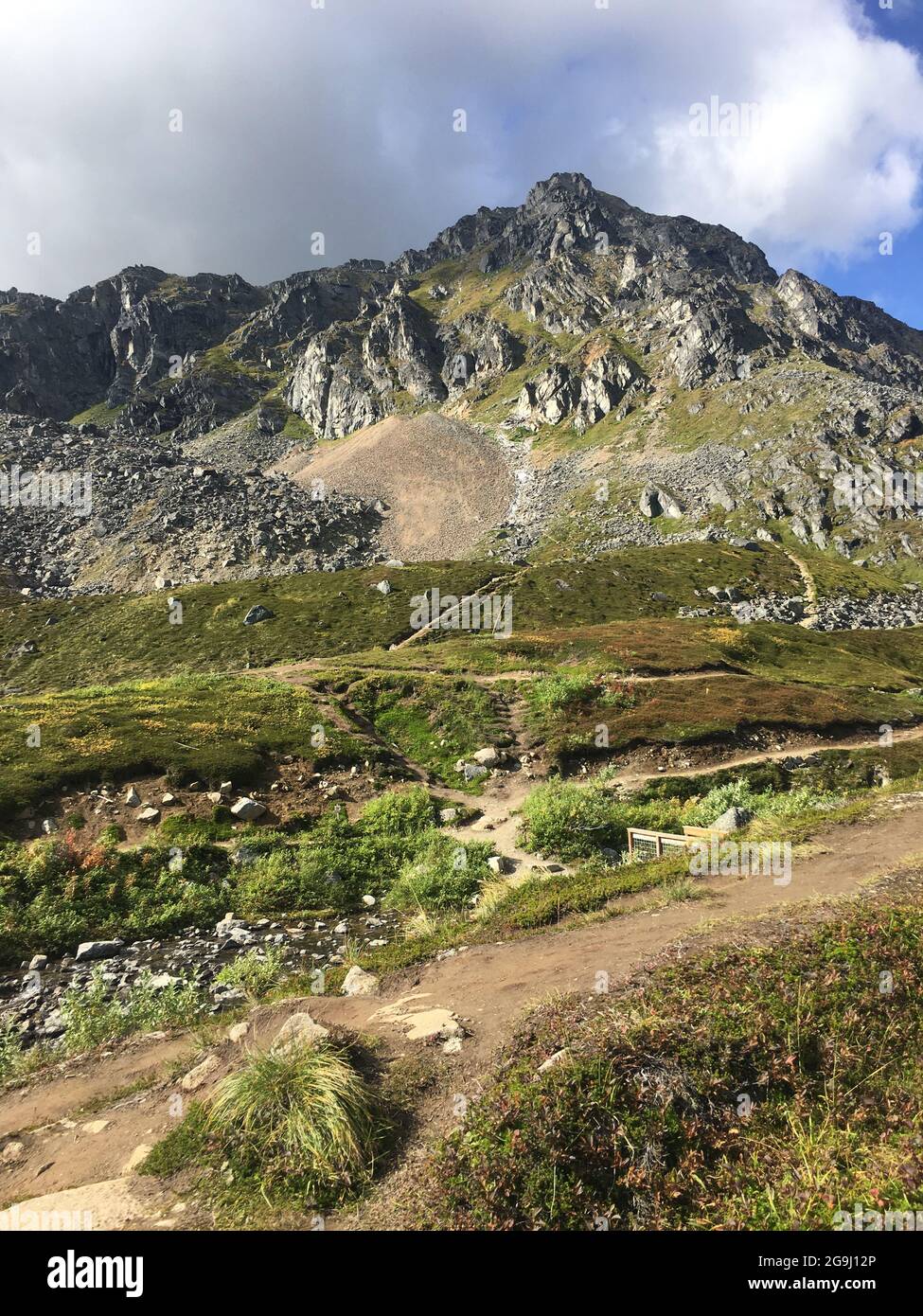 Vertical shot of a rocky mountain landscape with narrow paths under a ...